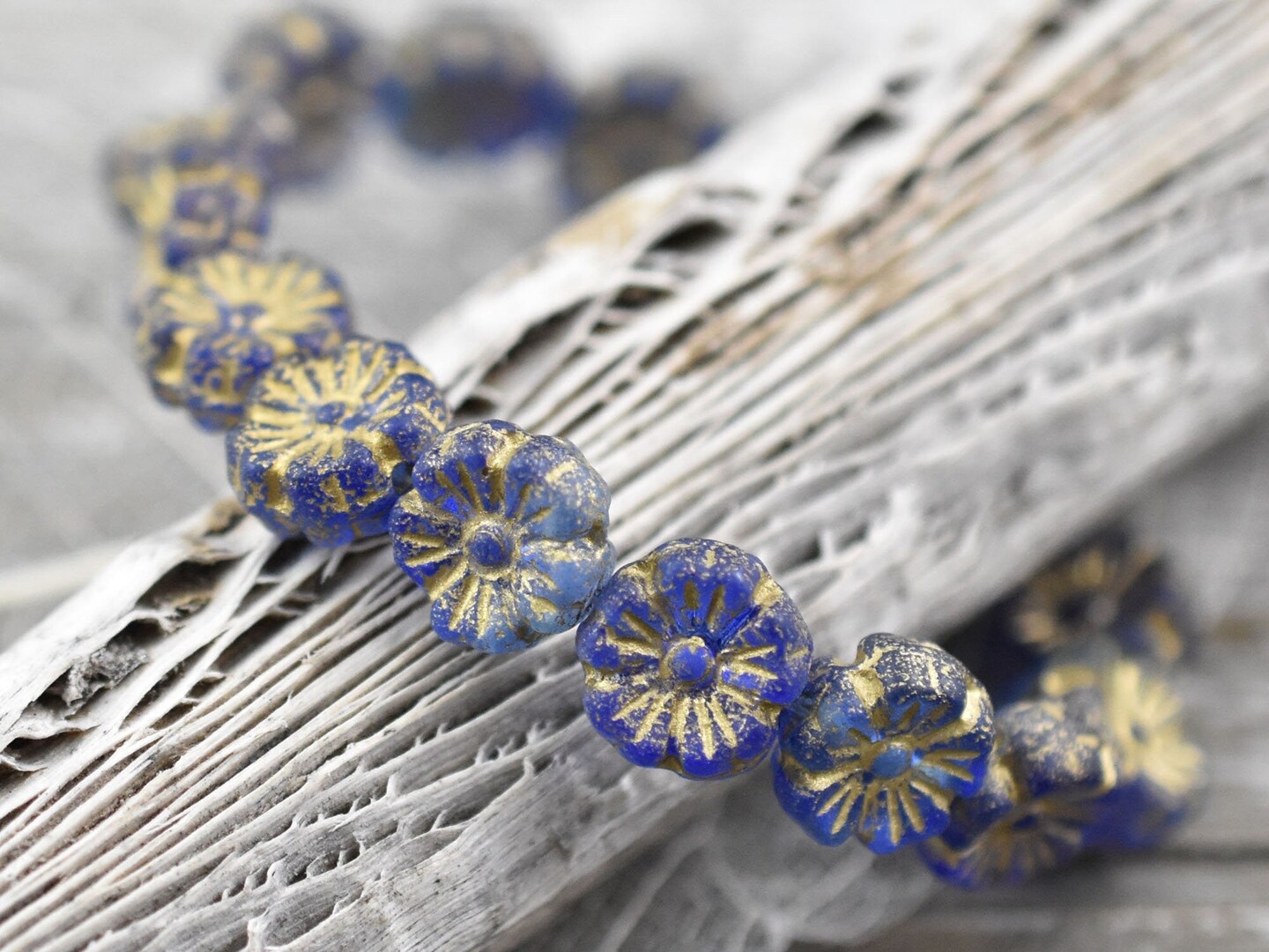 *16* 9mm Gold Washed Etched Sapphire Hawaiian Flower Beads | Michaels
