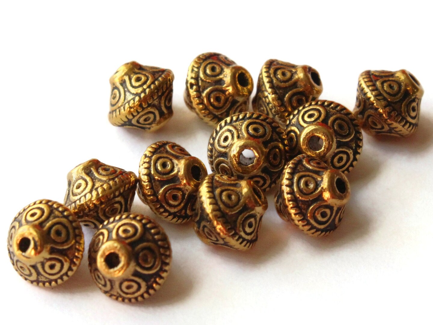 12 6.5mm Antique Golden Patterned Bicone Beads | Michaels