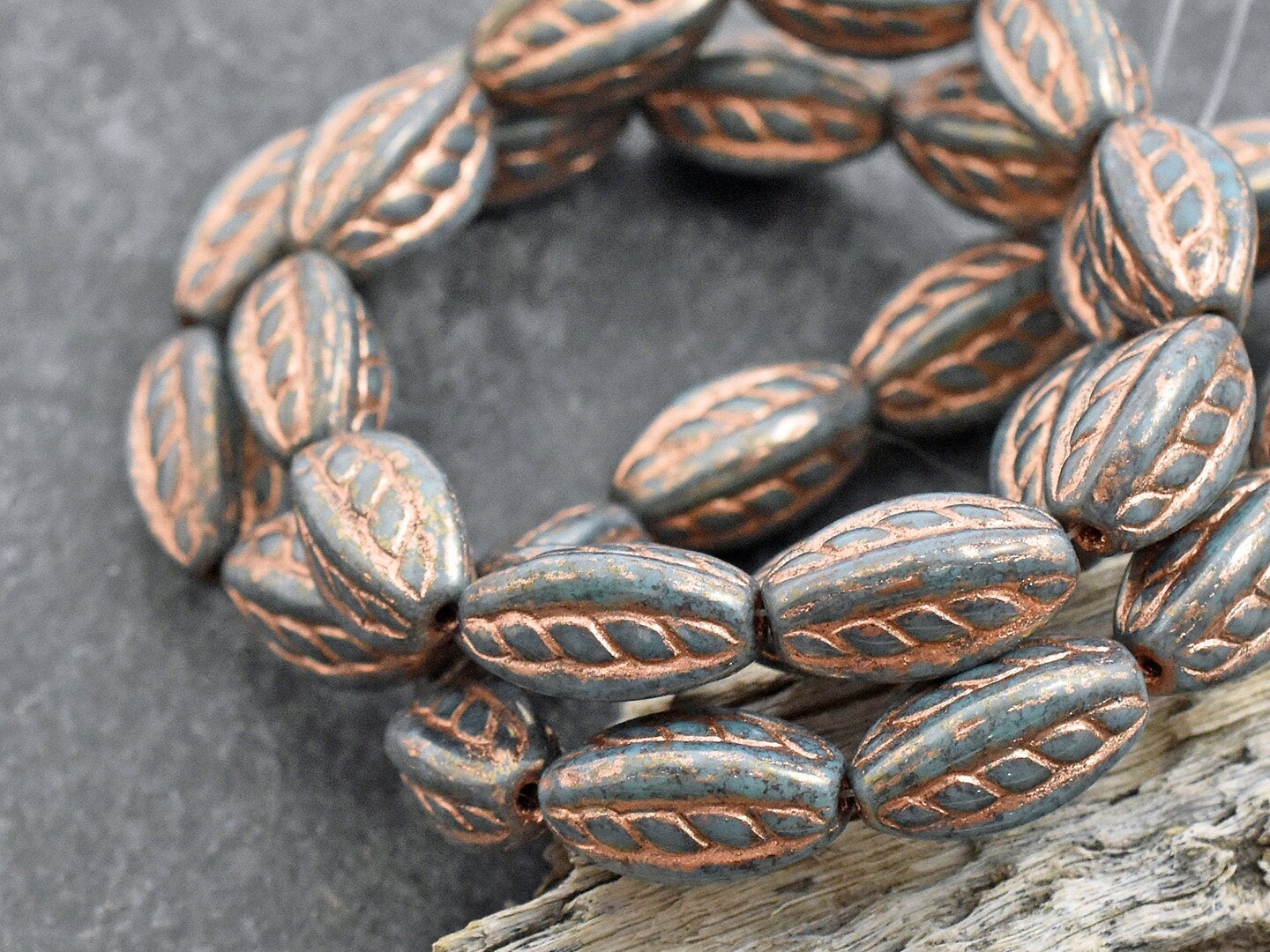 *10* 15x9mm Copper Washed Teal Blue Twisted Oval Beads | Michaels