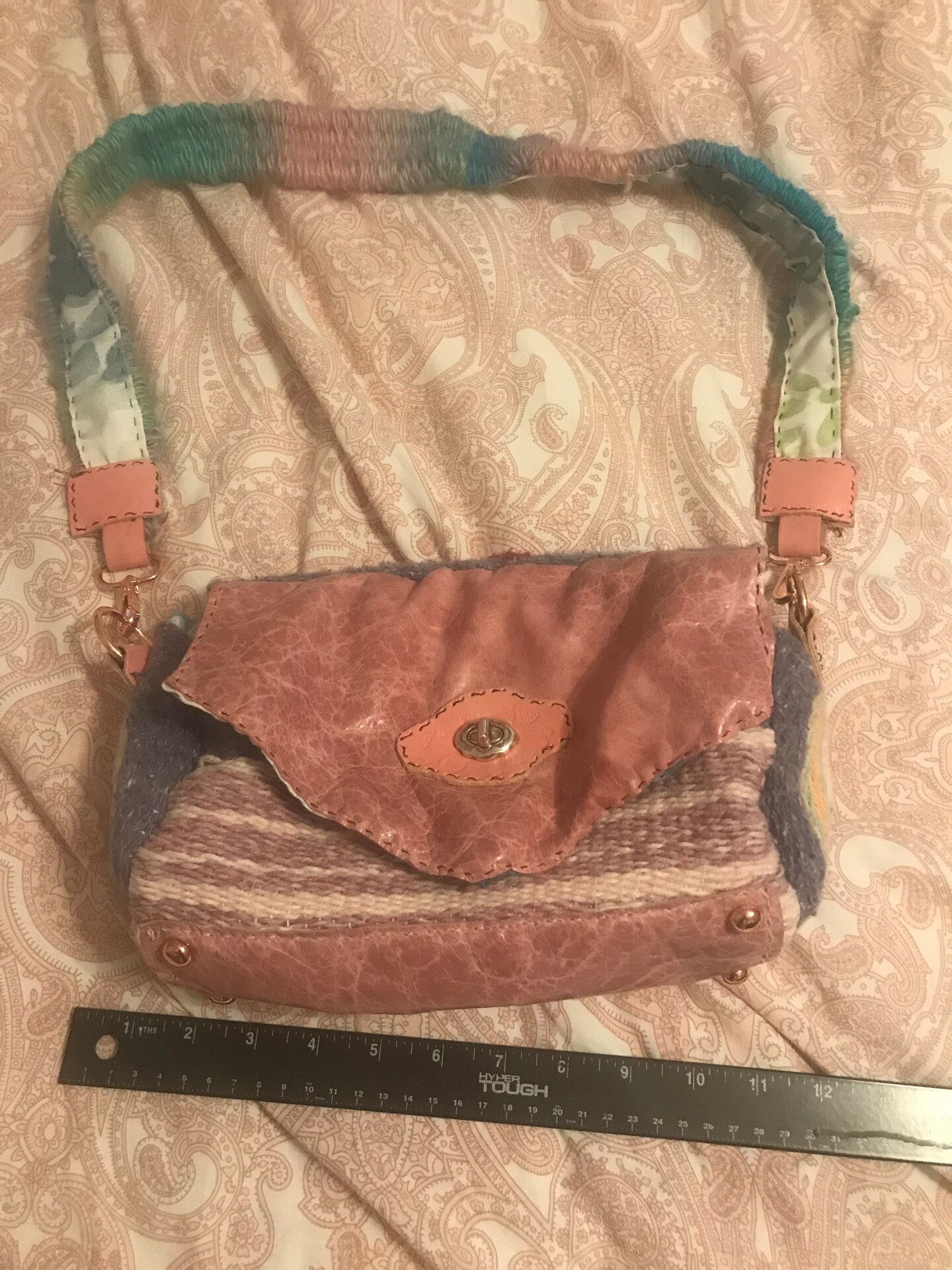 Purse that is like an cross over or on the shoulder it has art design ...