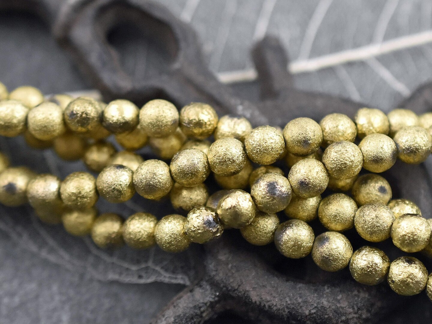 *25* 6mm Etched Gold Ore Round Druk Beads | Michaels