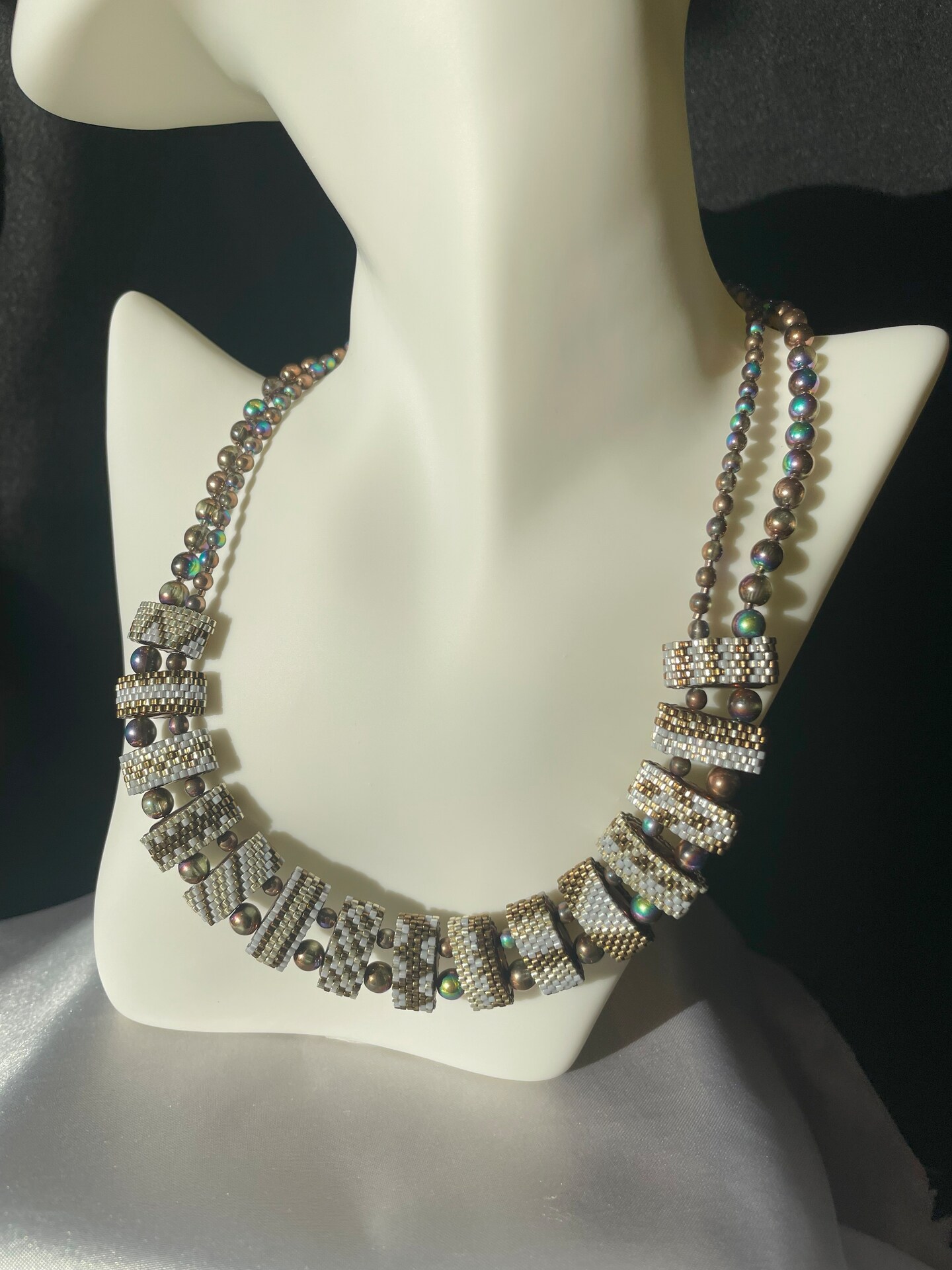 18-inch carrier bead necklace. These beads are covered with Cylinder ...