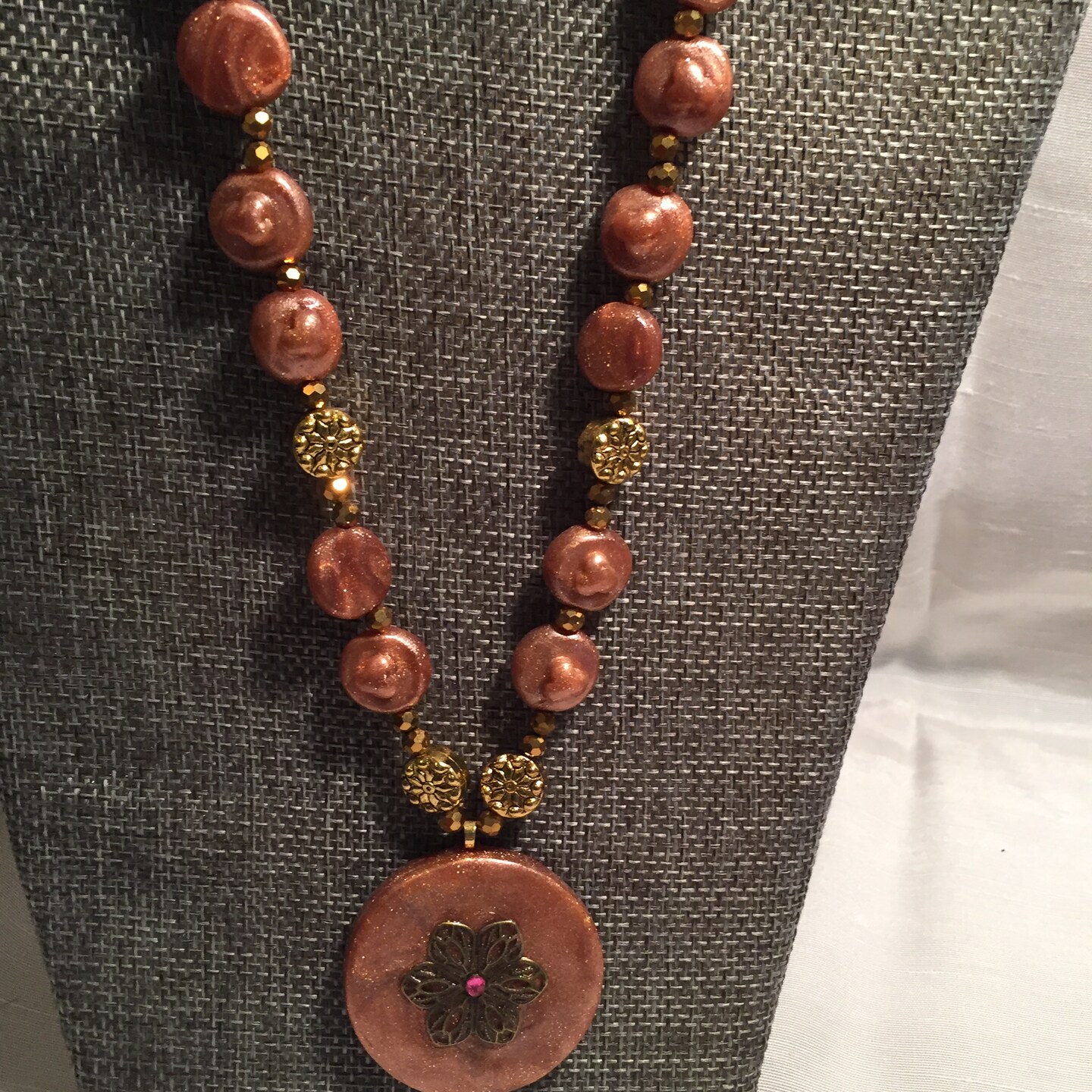 Gold and Brown Necklace is made with brown and gold beads the pendent ...