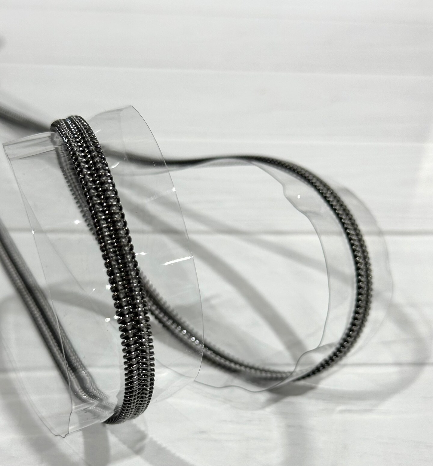 Clear vinyl zipper tape with gunmetal teeth | Michaels