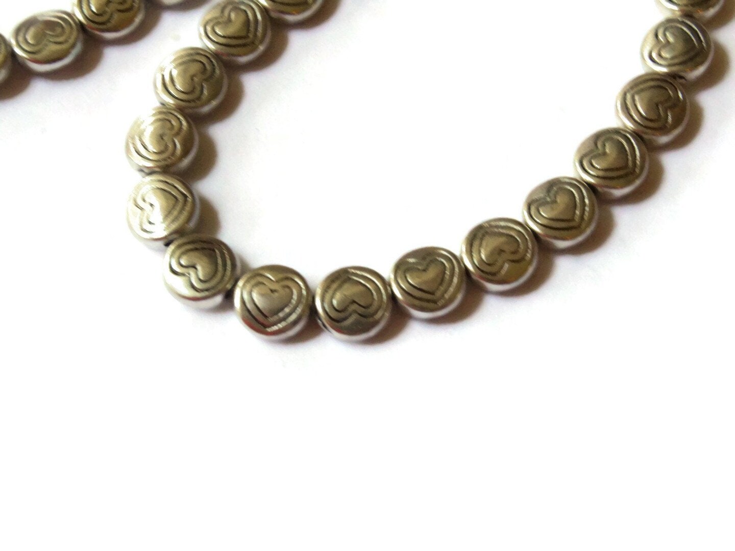 33 6.5mm Silver Heart Coin Beads Spacer Beads 8 Inch Strand | Michaels