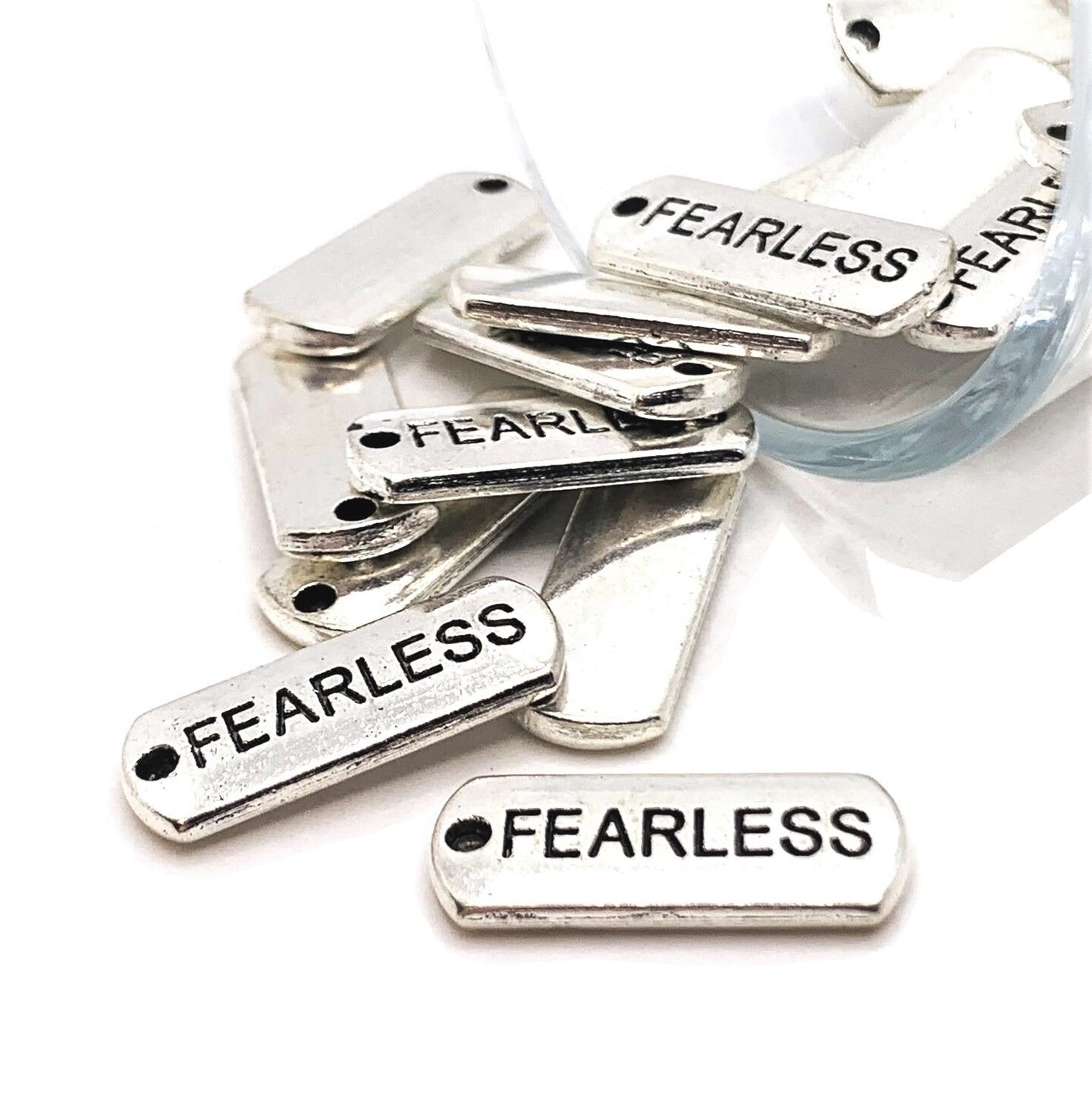 4, 20 or 50 Pieces: Silver Fearless Word Bar Tag Charms | Michaels