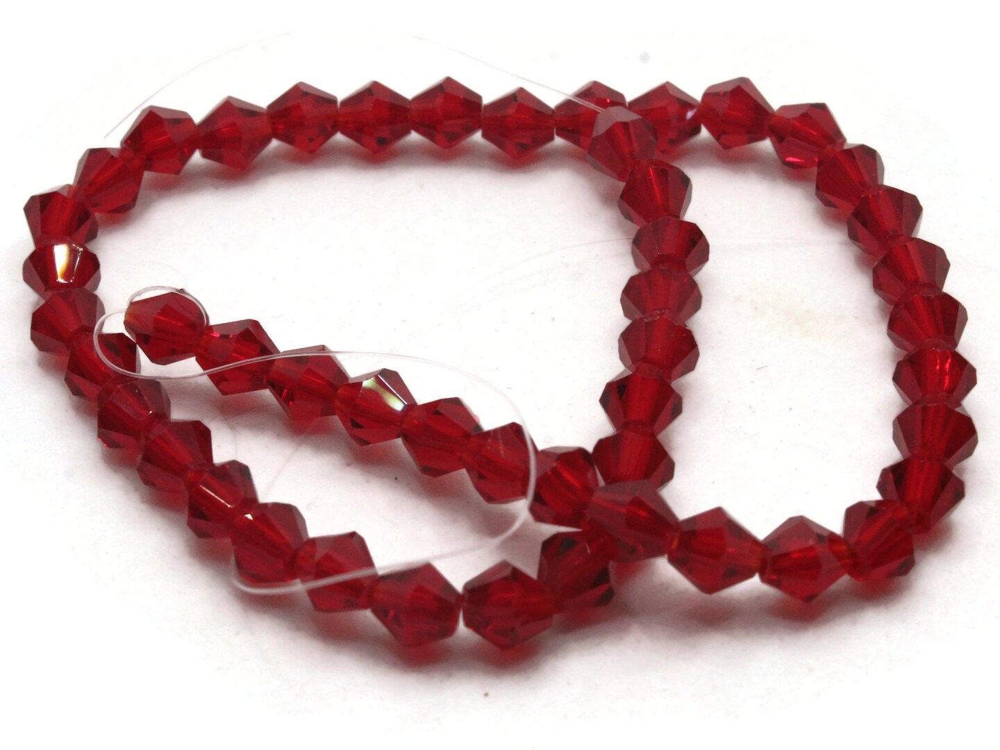 49 6mm Red Glass Faceted Bicone Beads | Michaels