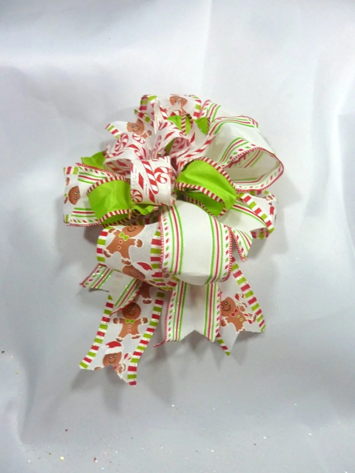 Red, White, and Green gingerbread Man wreath bow | MakerPlace by Michaels