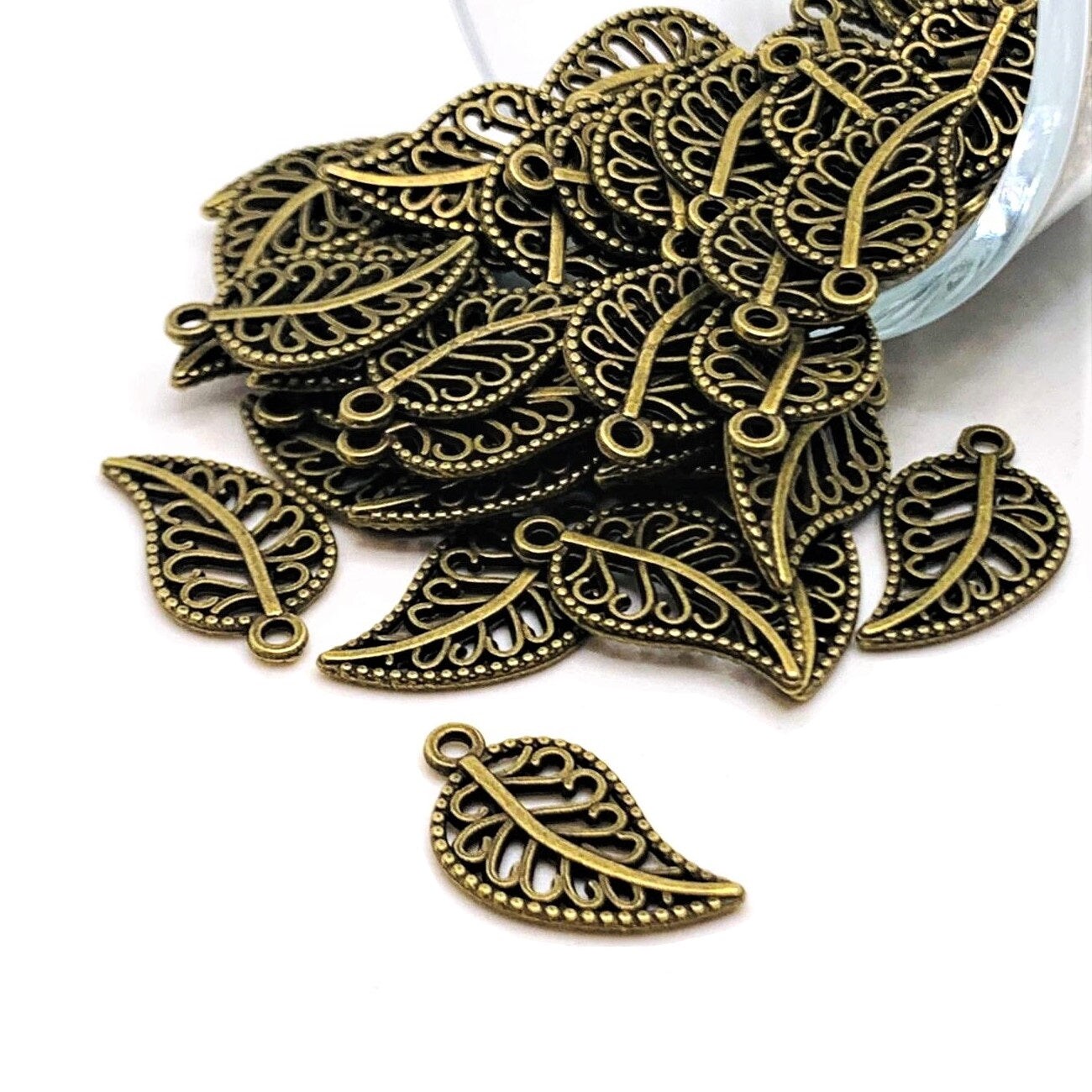 4, 20 or 50 Pieces: Small Scrolled Bronze Leaf Charms | Michaels