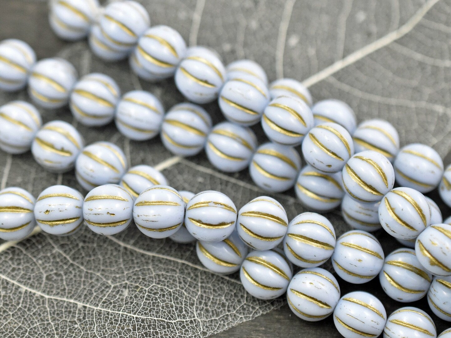 *16* 8mm Gold Washed Pale Opaque Blue Round Melon Beads | Michaels