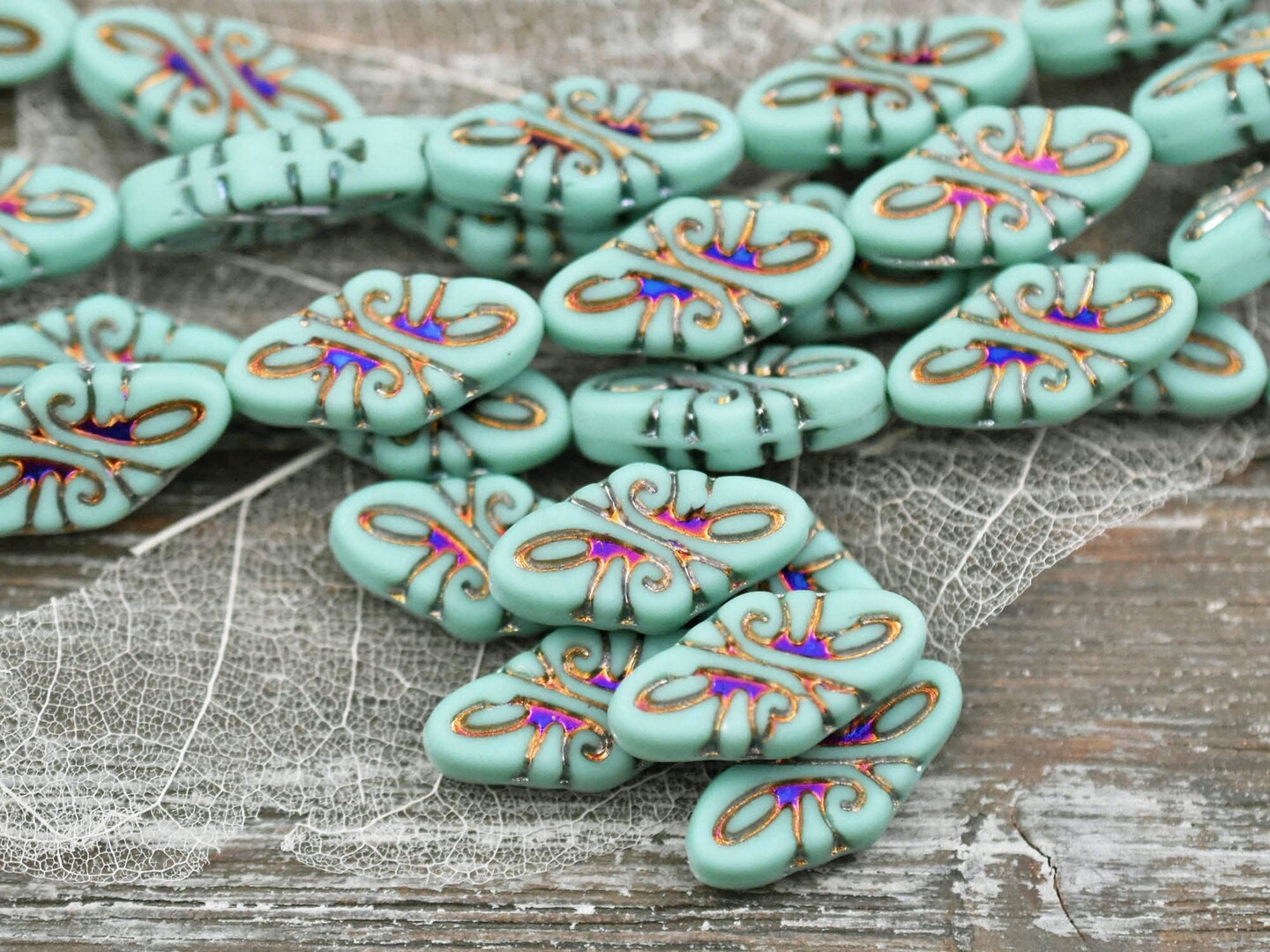 *6* 19x9mm Matte Turquoise Sliperit Arabesque Beads | Michaels