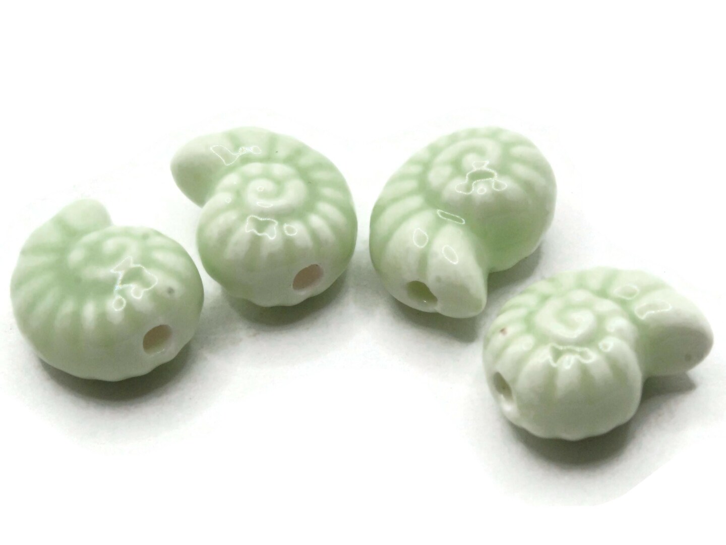 4 14mm Light Green Porcelain Spiral Seashell Beads | Michaels