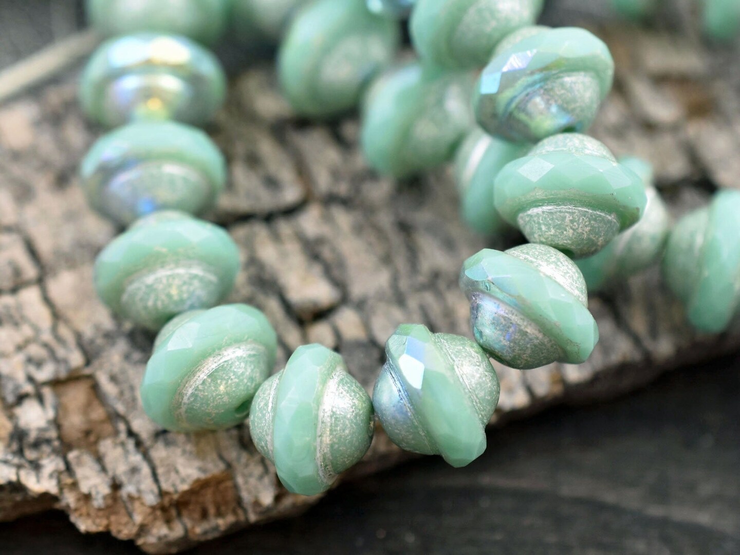 *15* 8x10mm Silver AB Washed Sea Green Saturn Beads | Michaels