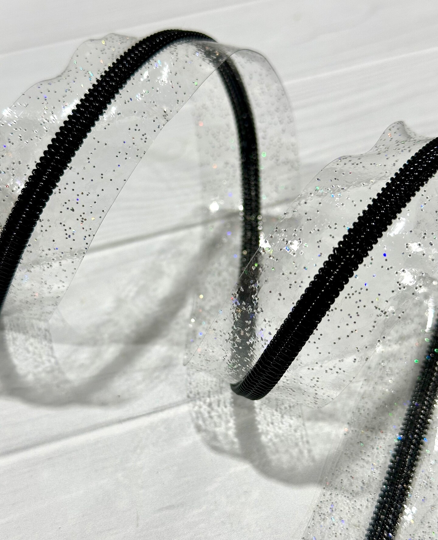 Clear holographic sparkle vinyl zipper tape with black teeth | Michaels